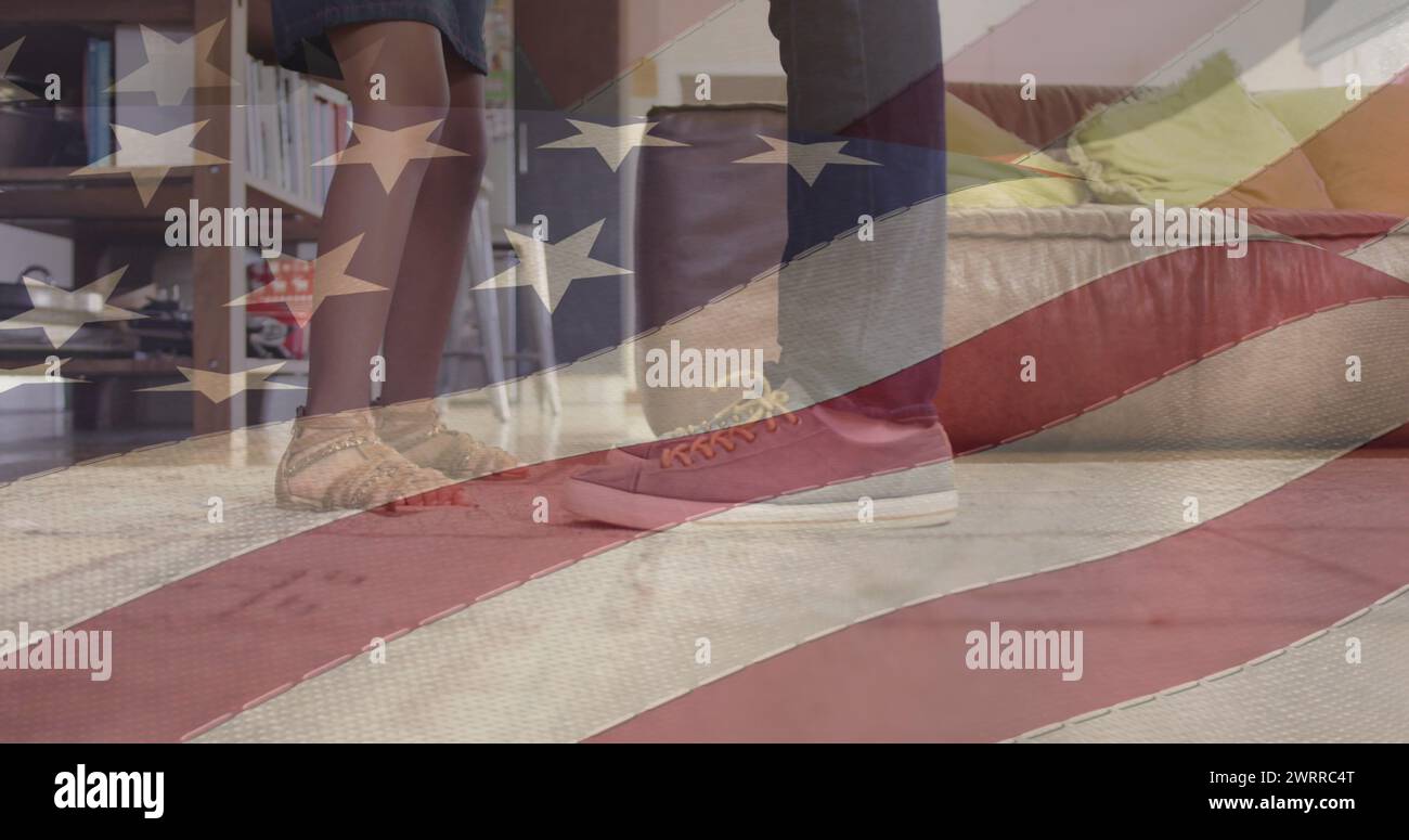 Image of flag of usa waving over foot of african american father ...