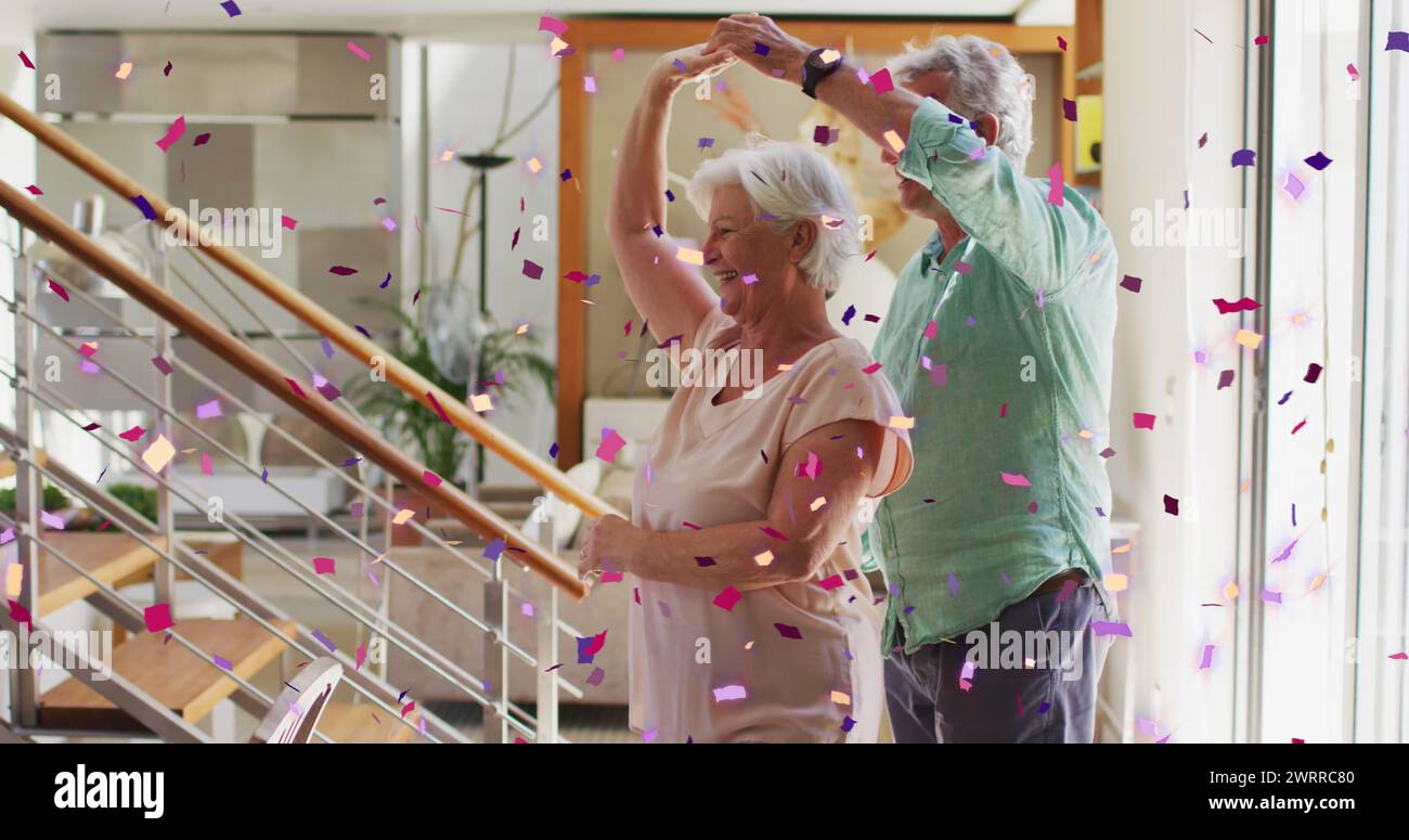 Image of pink and purple confetti falling over happy caucasian senior ...