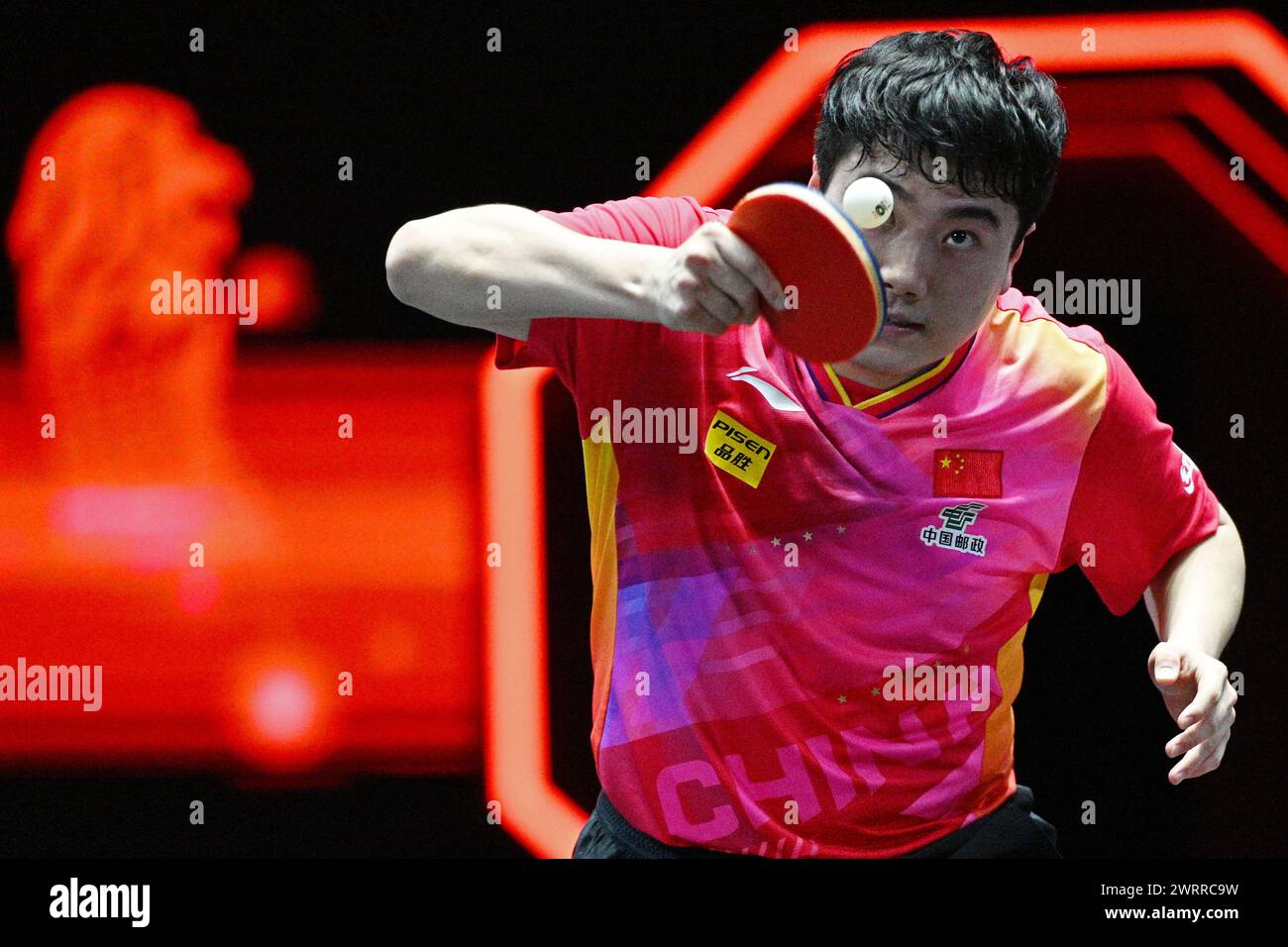 Singapore. 14th Mar, 2024. Liang Jingkun of China hits a return during ...