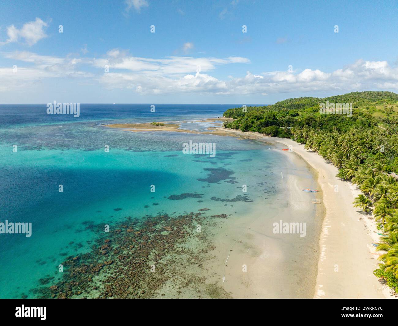 Boats on clear water. White sand beach in Santa Fe, Tablas, Romblon ...