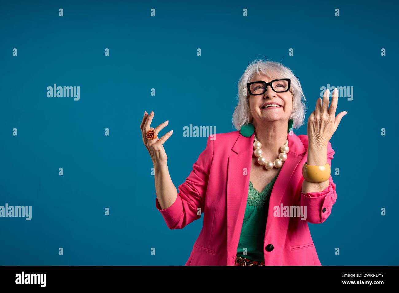 Elegant Senior Lady Laughing in Stylish Pink Blazer Stock Photo - Alamy