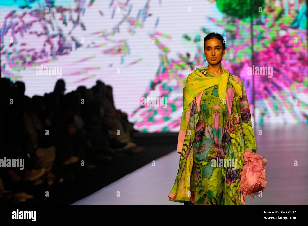 A model presents creations by designer house Yavi during the Fashion ...