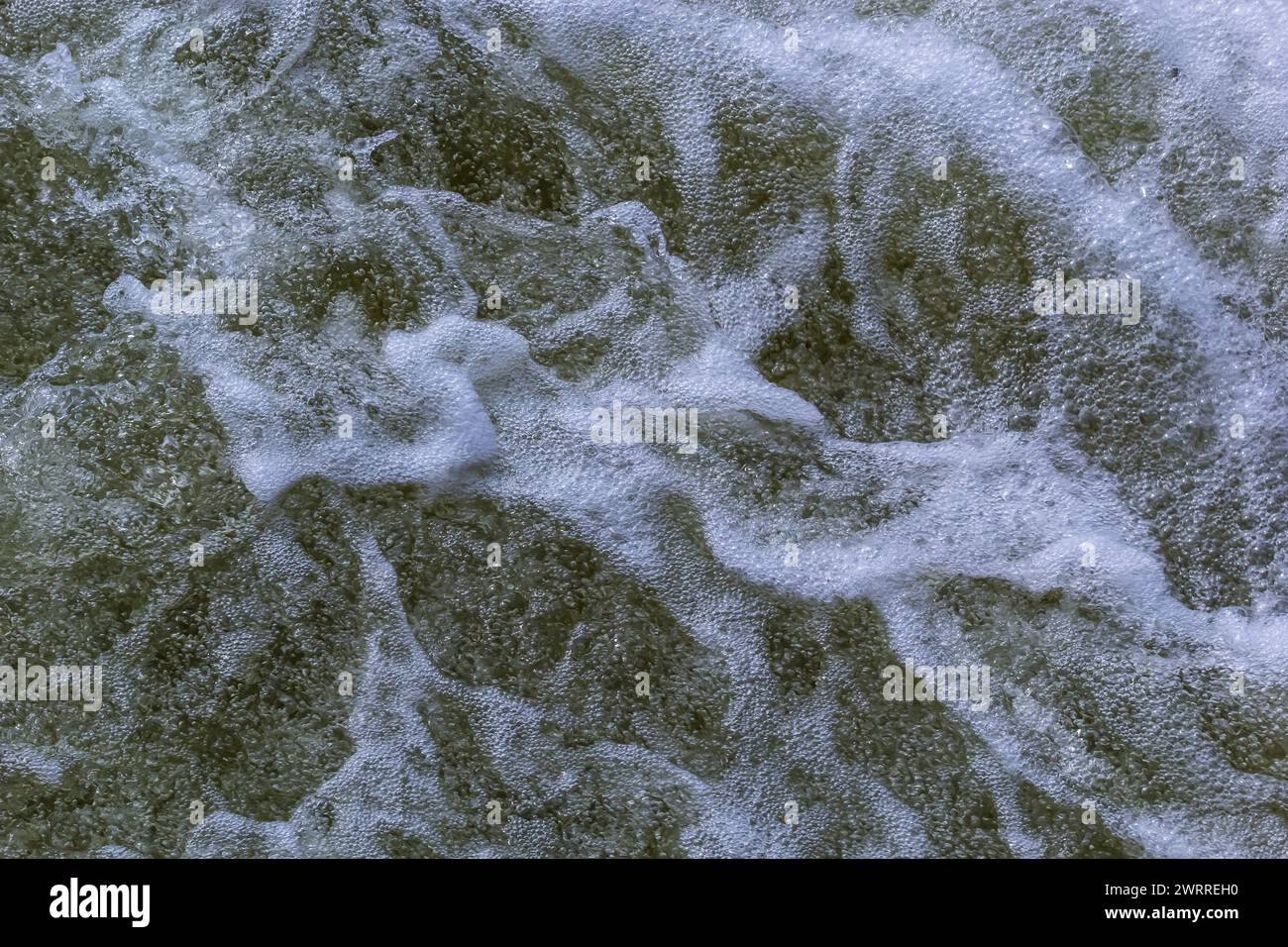 Close up detail of fierce white water river rapids from a clean deep ...