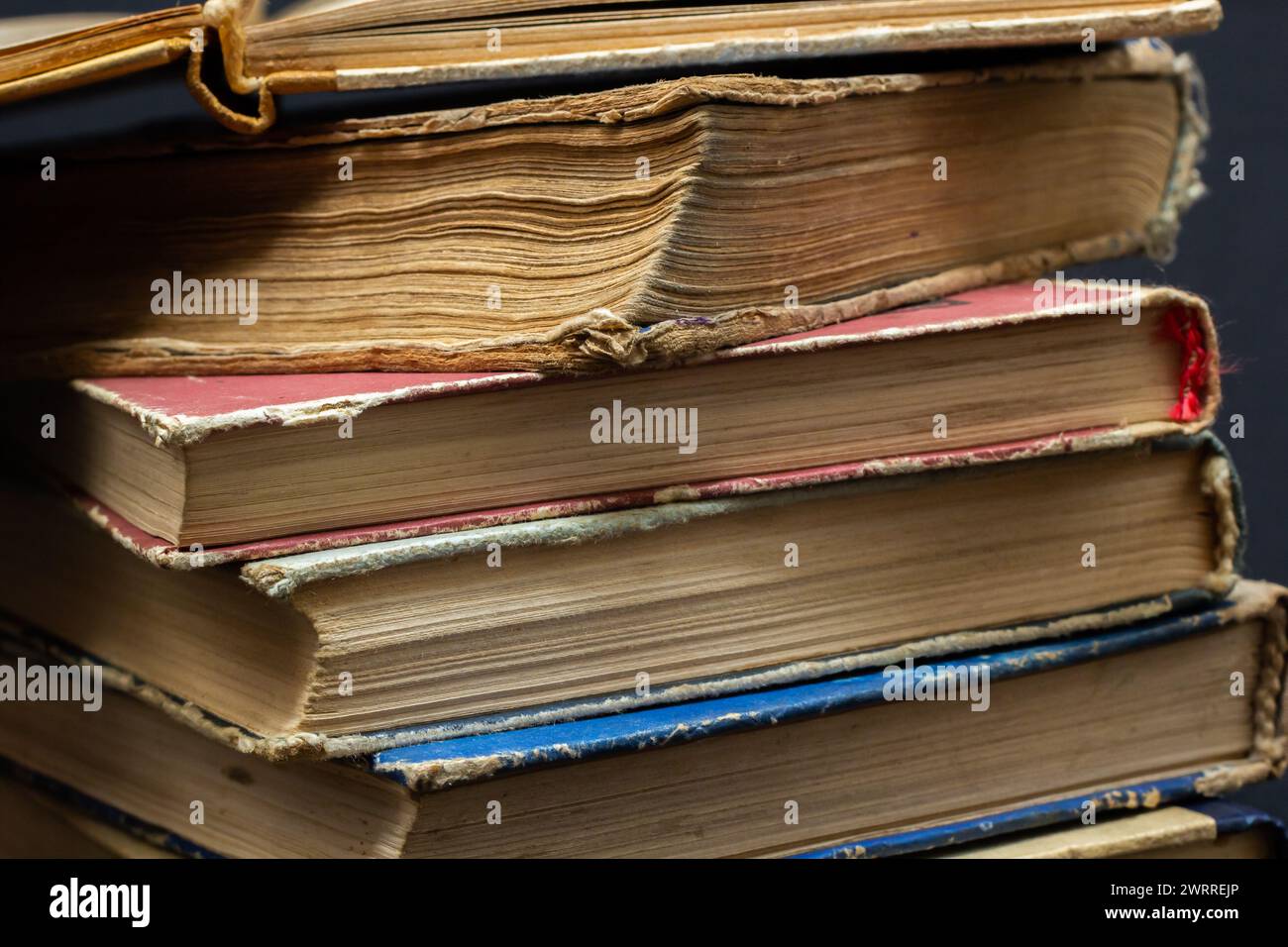 Book background. Stack of books in the library. Old yellow pages of ...