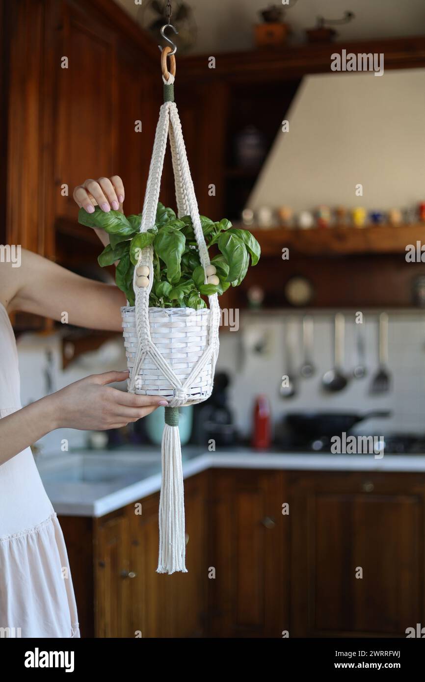 Woman hanging from rope hi-res stock photography and images - Alamy