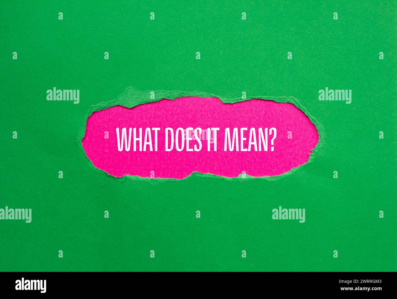 What does it mean words written on green torn paper with pink background. Conceptual symbol ...