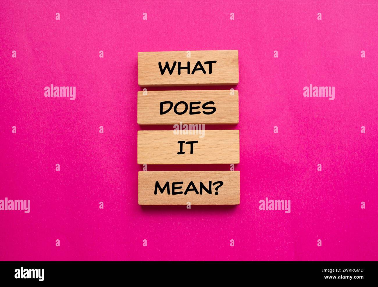 What does it mean words written on wooden blocks with pink background ...