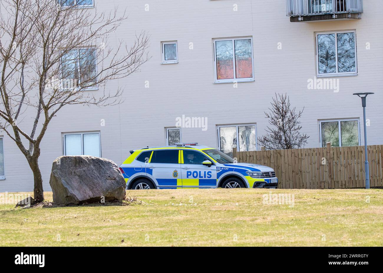 Police car at fence in front of a building Stock Photo - Alamy