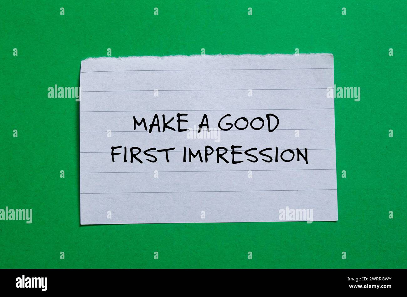 Make a good first impression words written on torn paper piece with ...