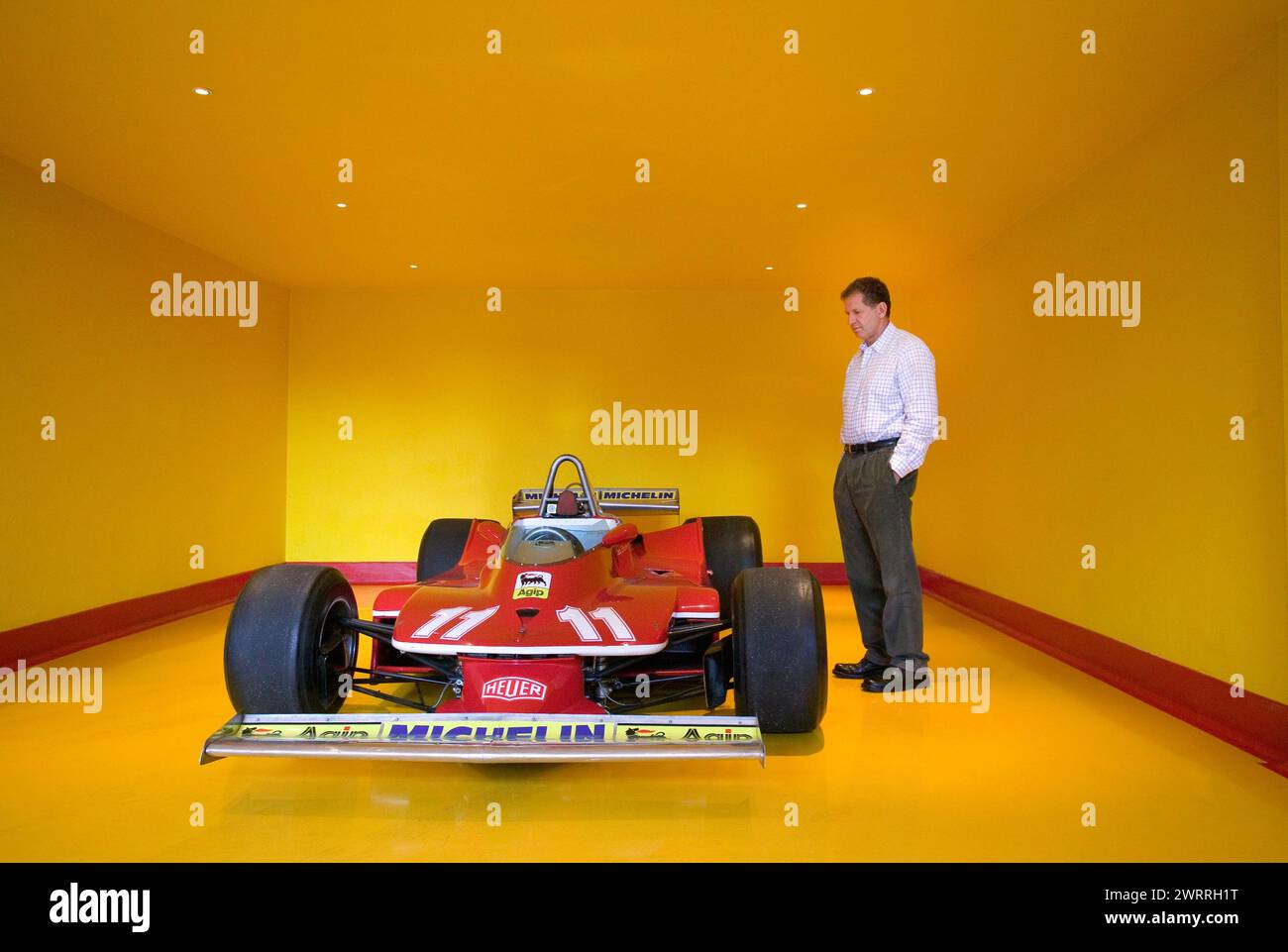 Jody Scheckter in his garage with his 1979 Ferrari 312 T4 in which he ...