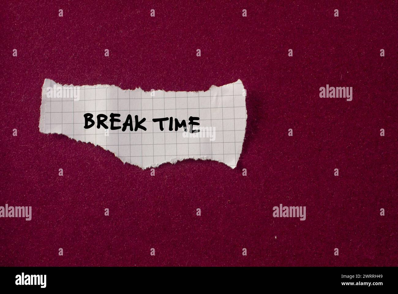 Break time words written on torn paper with purple background ...
