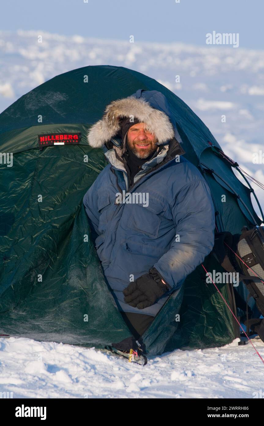 Photographer Steven Kazlowski with camera tripod and Hilleberg tent ...
