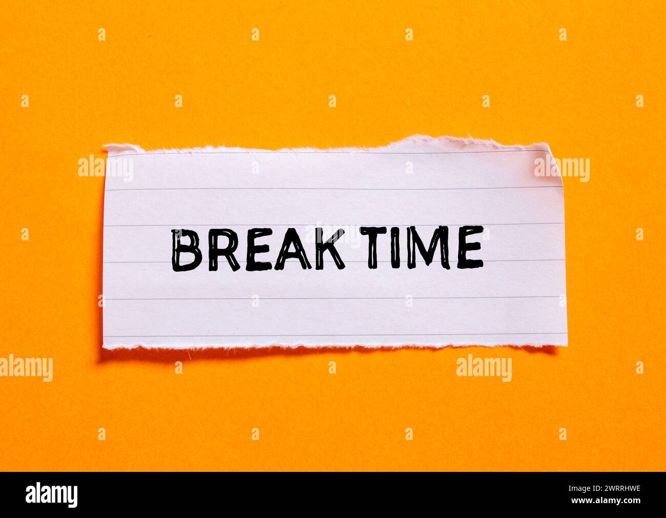 Break time words written on torn paper with orange background ...