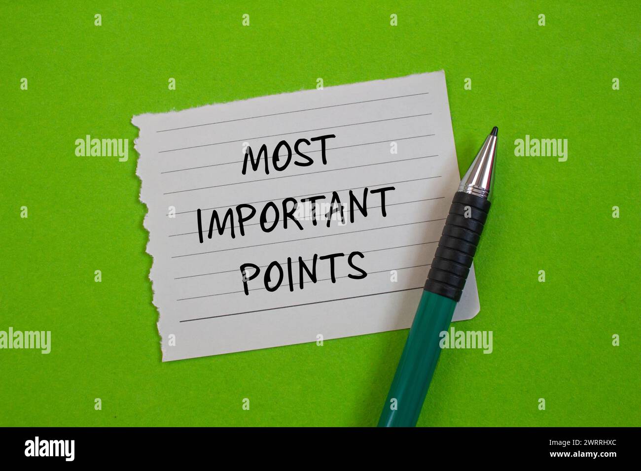 Most important points words written on torn paper piece with green ...