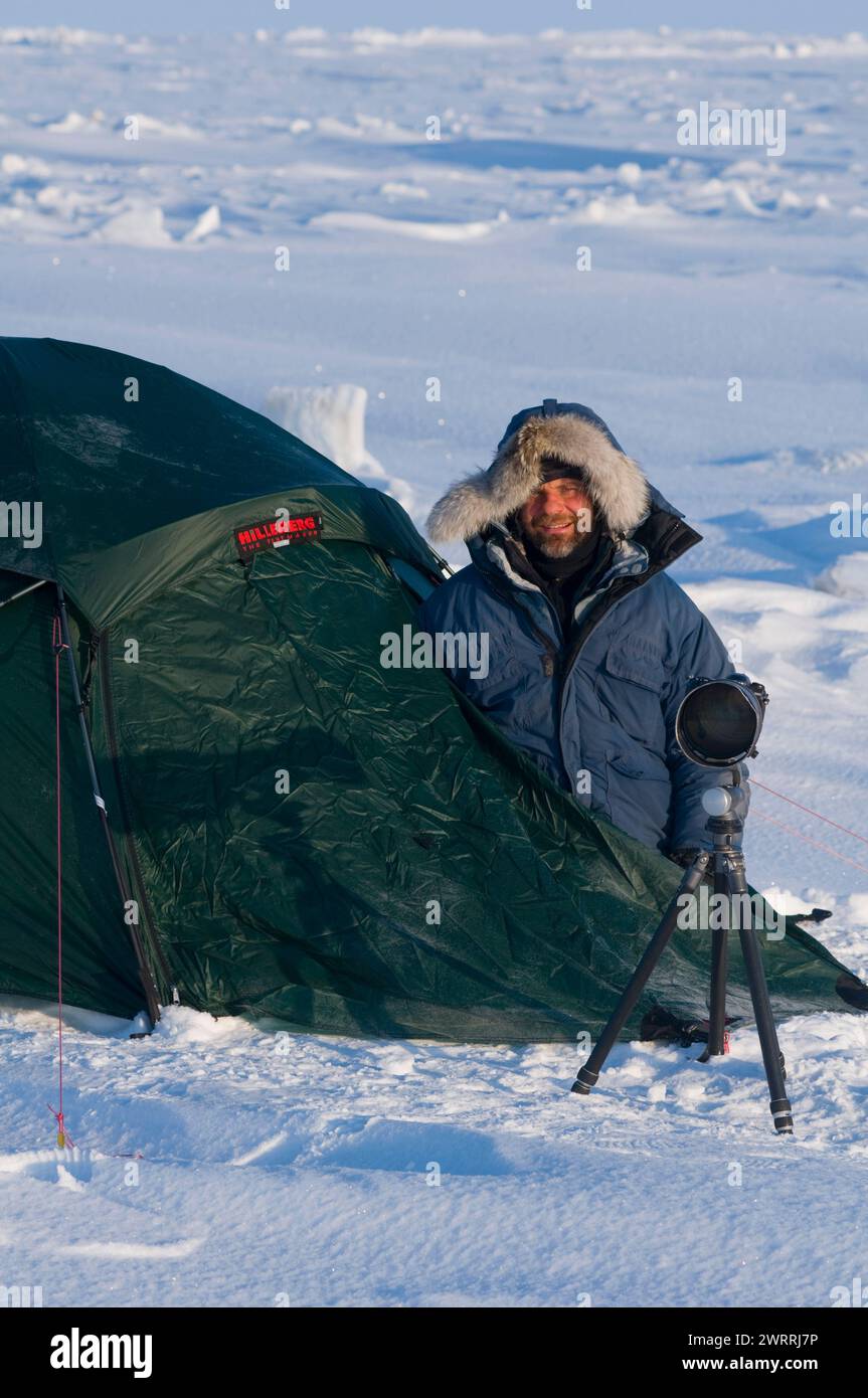 Photographer Steven Kazlowski with camera tripod and Hilleberg tent ...