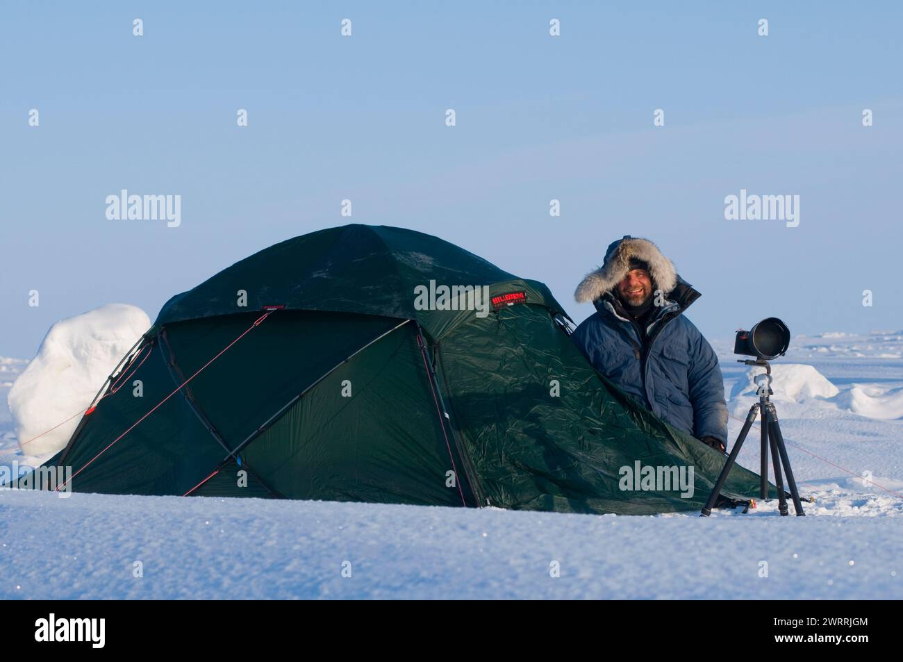 Photographer Steven Kazlowski with camera tripod and Hilleberg tent ...