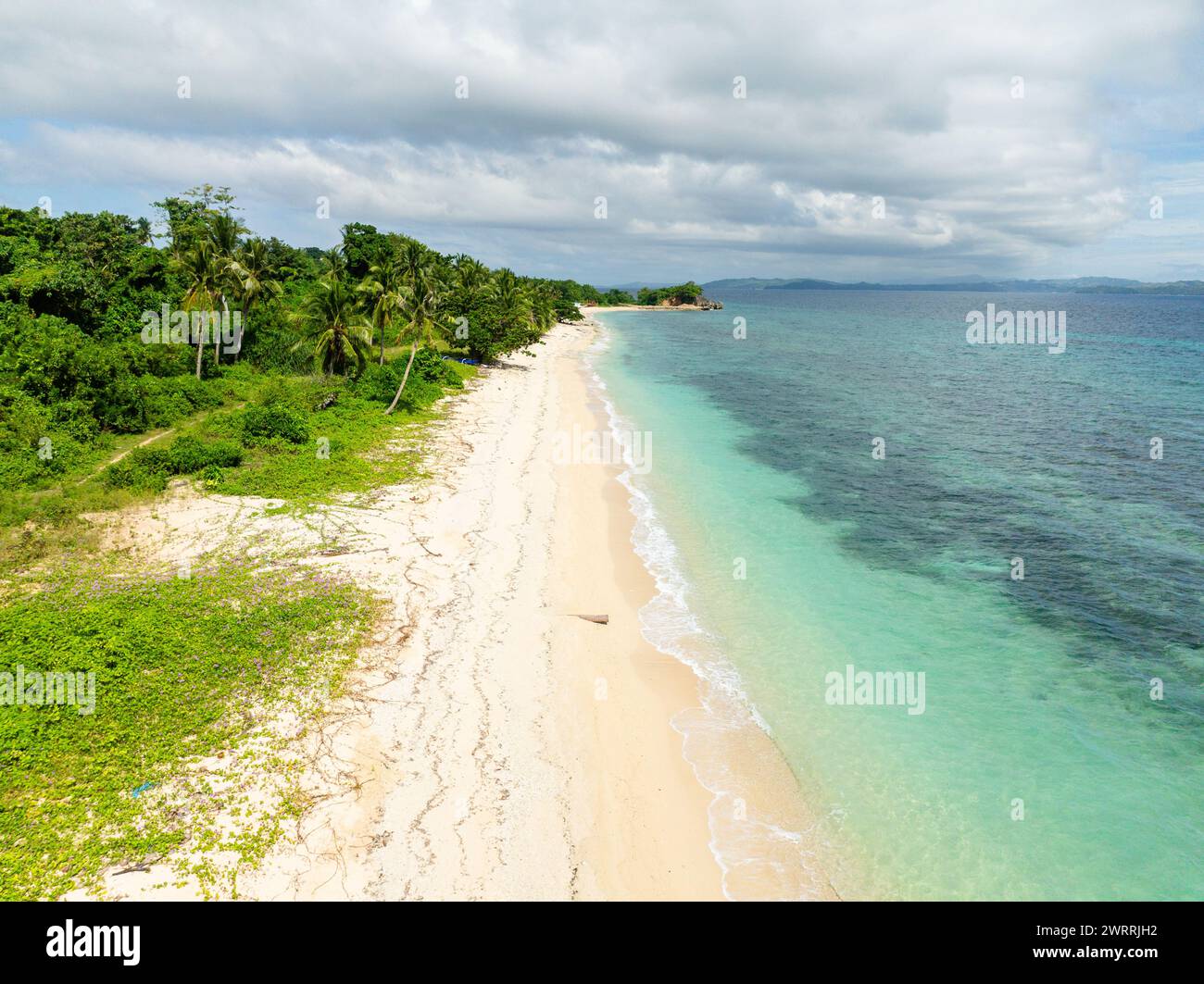 Transparent sea water on white sandy beach. Carabao Island. San Jose ...