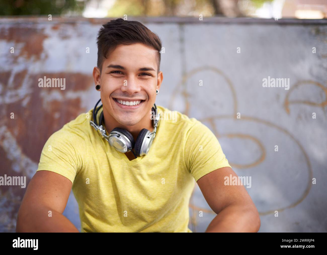 Smile, portrait and young man at skatepark for skating practice or ...