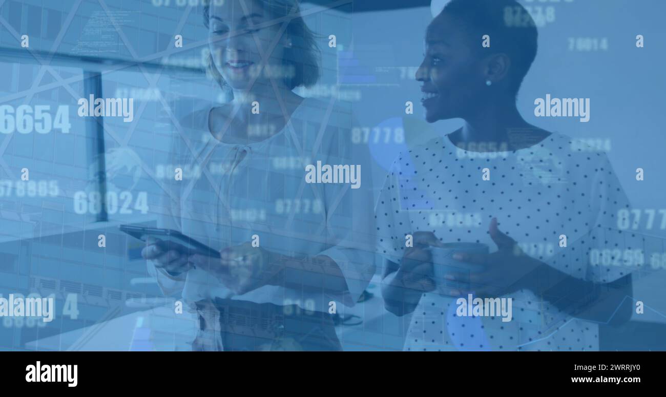 Image of numbers changing over diverse female coworkers in office Stock ...