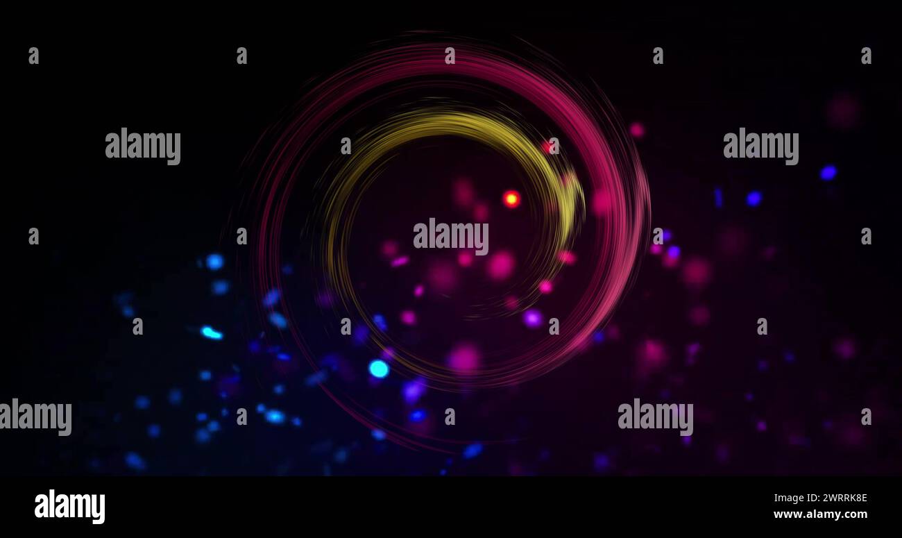 Image of colourful light trails and spots forming circles on black ...