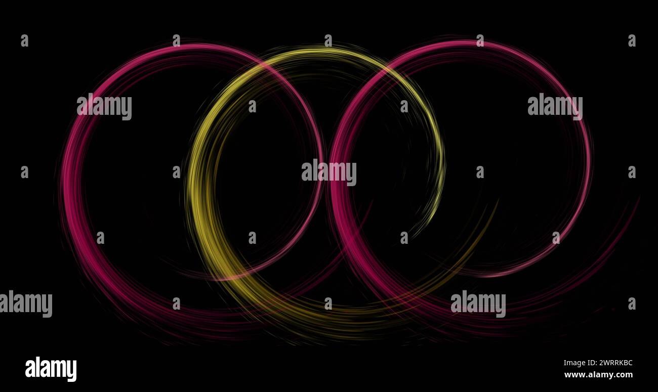 Image of colourful light trails forming circles on black background ...