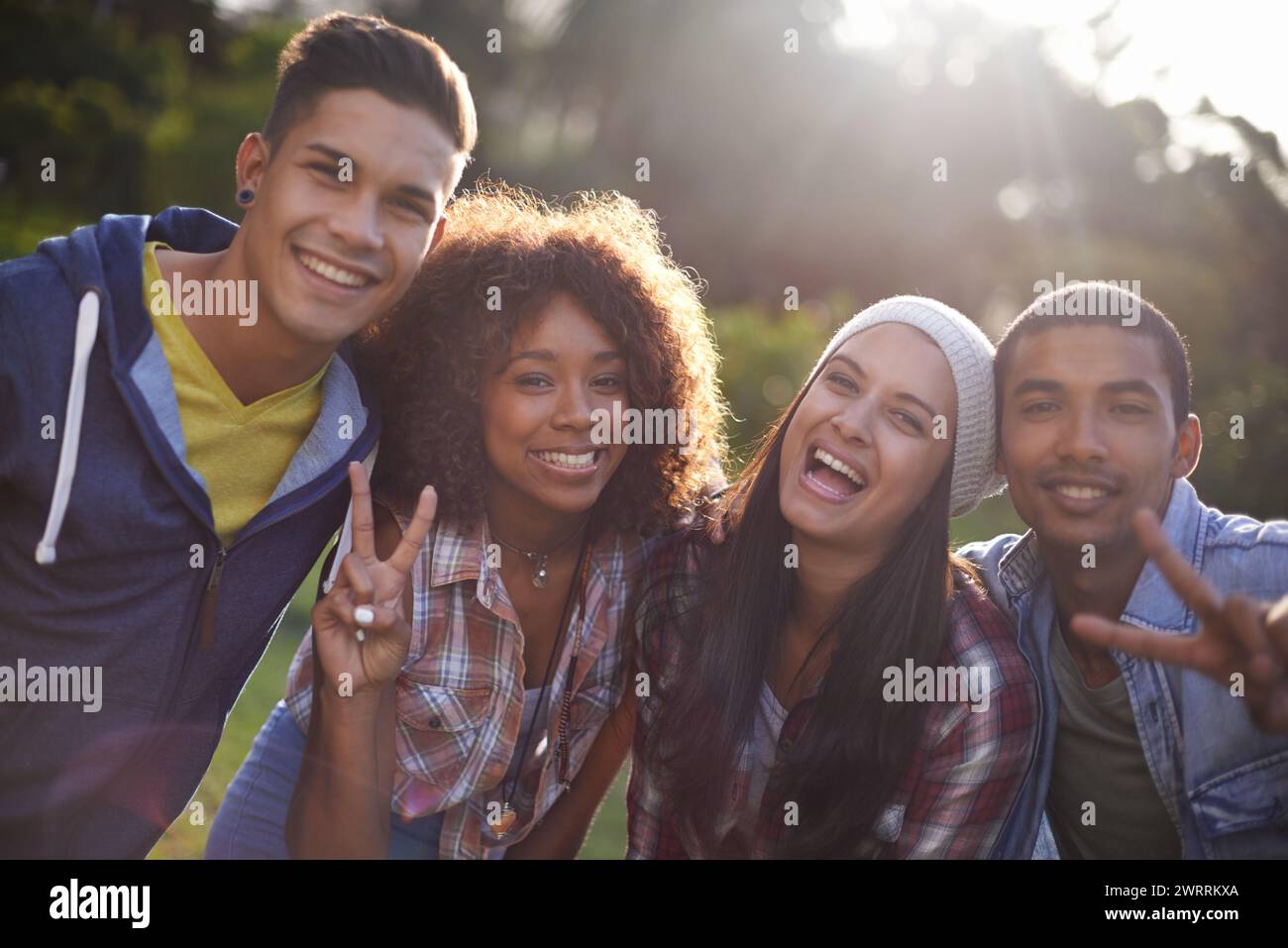 Portrait, smile and diversity friends in nature, outdoors or garden ...