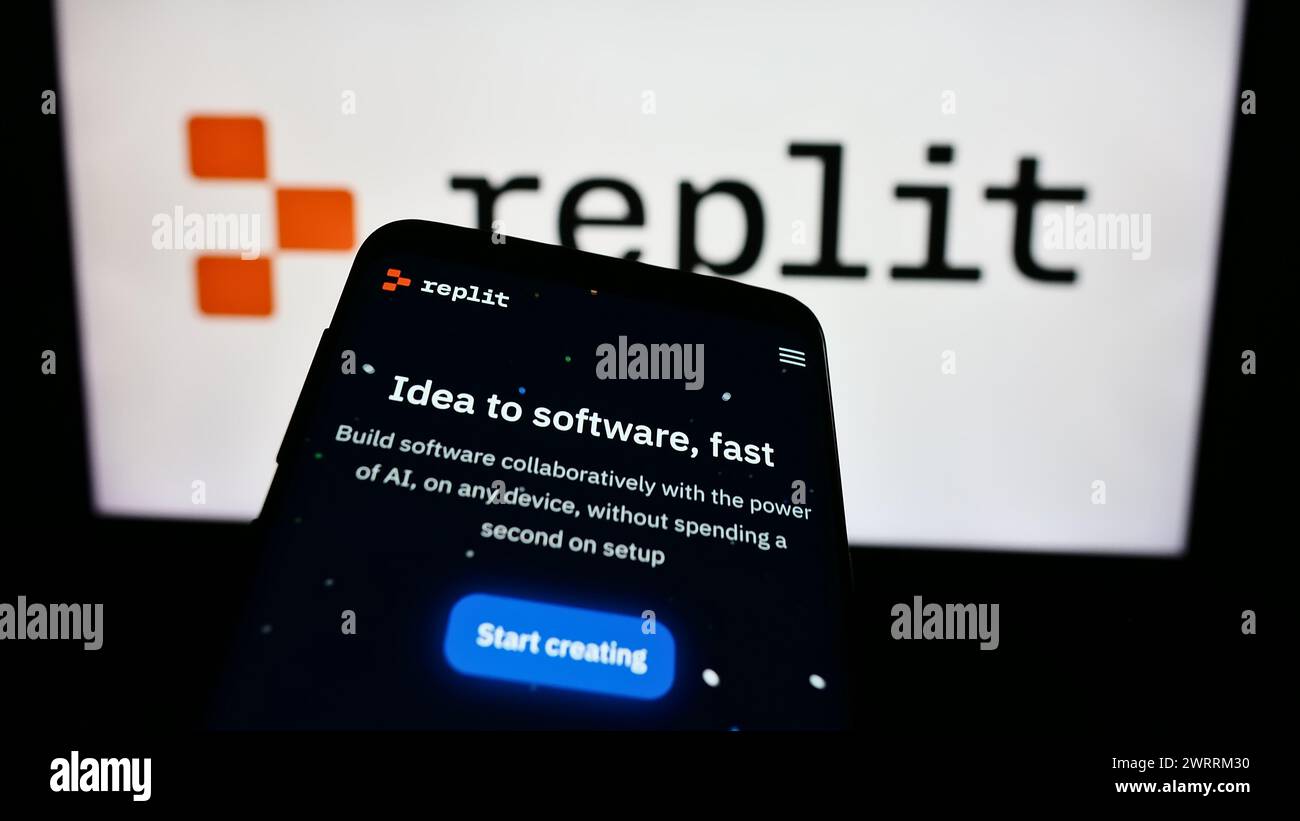 Mobile phone with website of US software development platform company Replit Inc. in front of ...