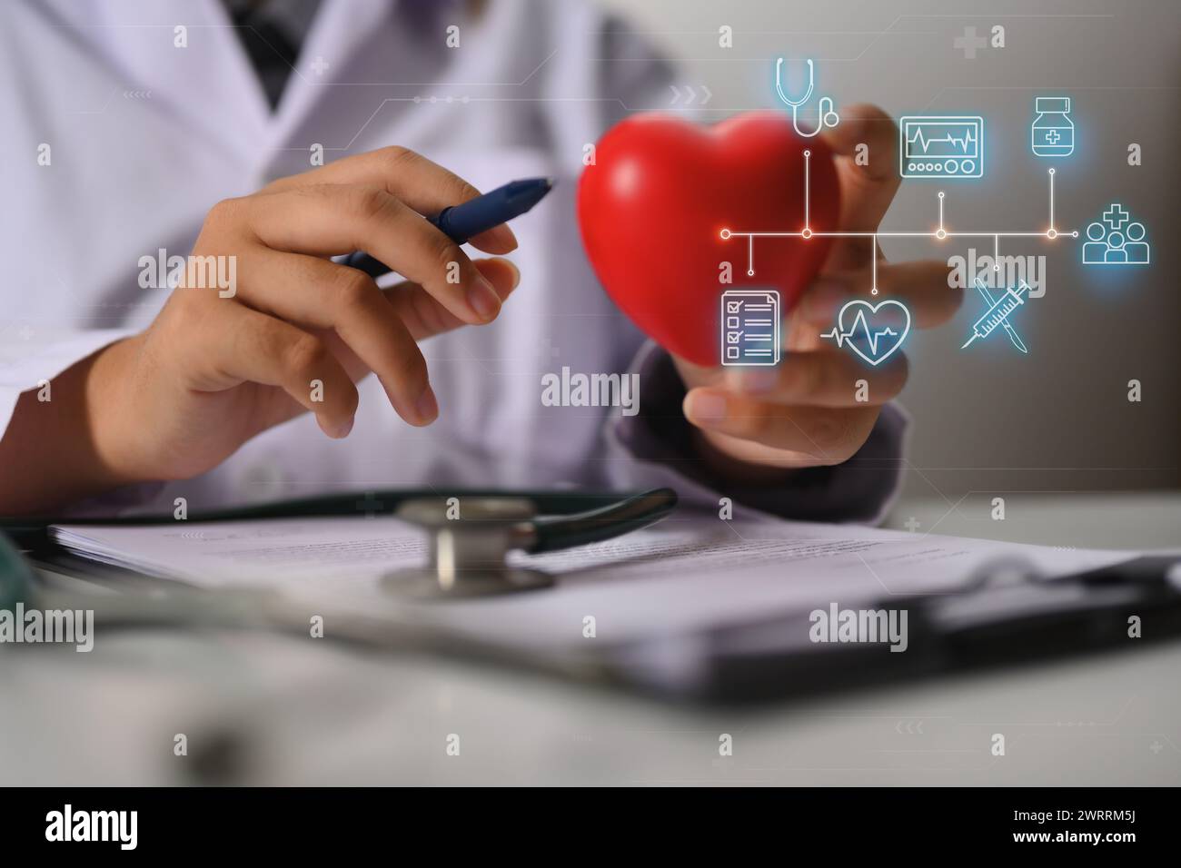 Female doctor with stethoscope holding red heart shape. Medical, health ...