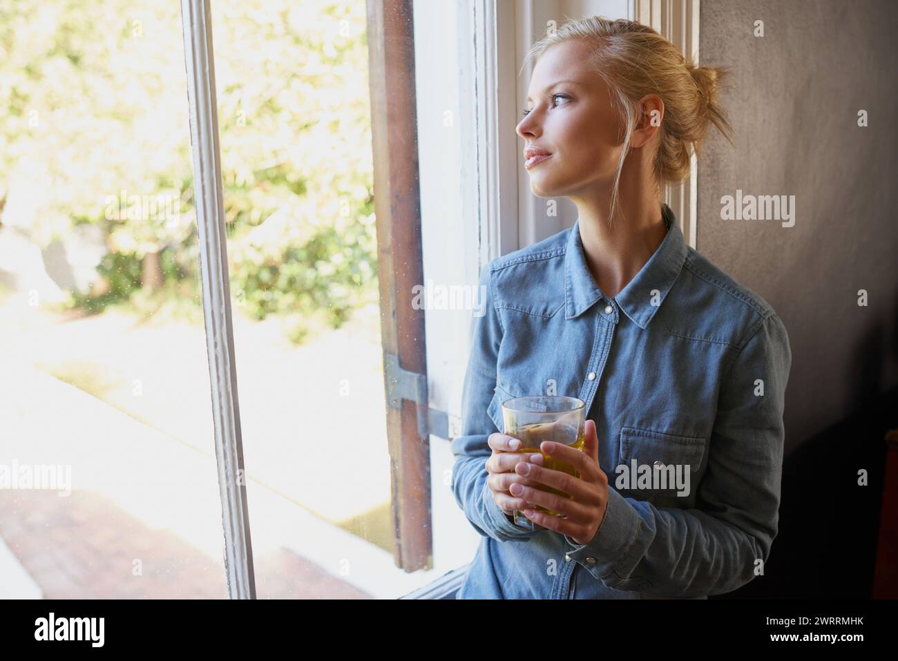 Thinking, calm and woman with tea in a house for peaceful, reflection ...