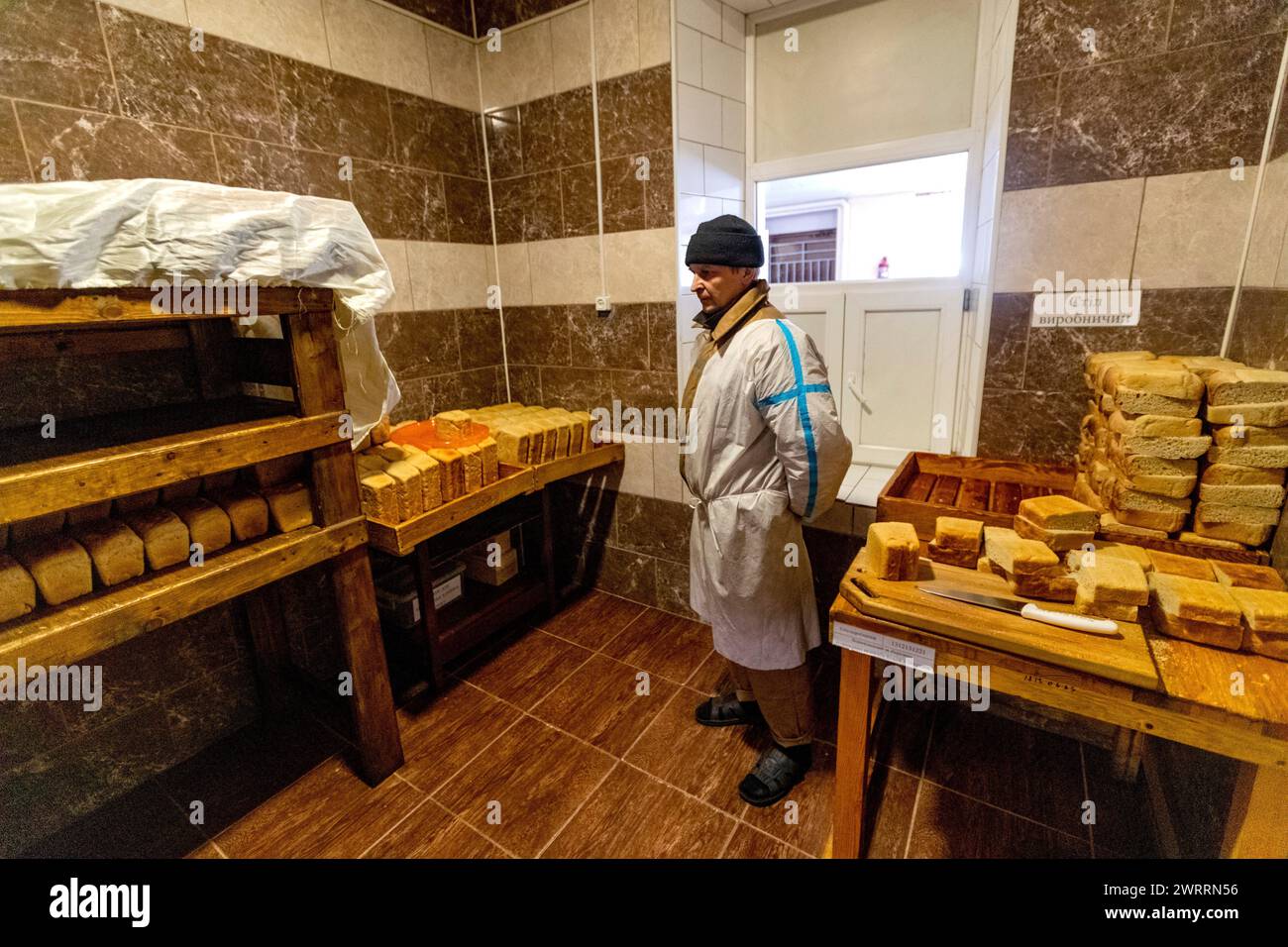 UKRAINE - MARCH 17, 2024 - A Russian POW looks at the bread at the ...