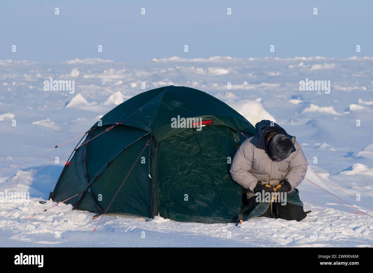 Photographer with camera and Hilleberg tent camped along the arctic ...