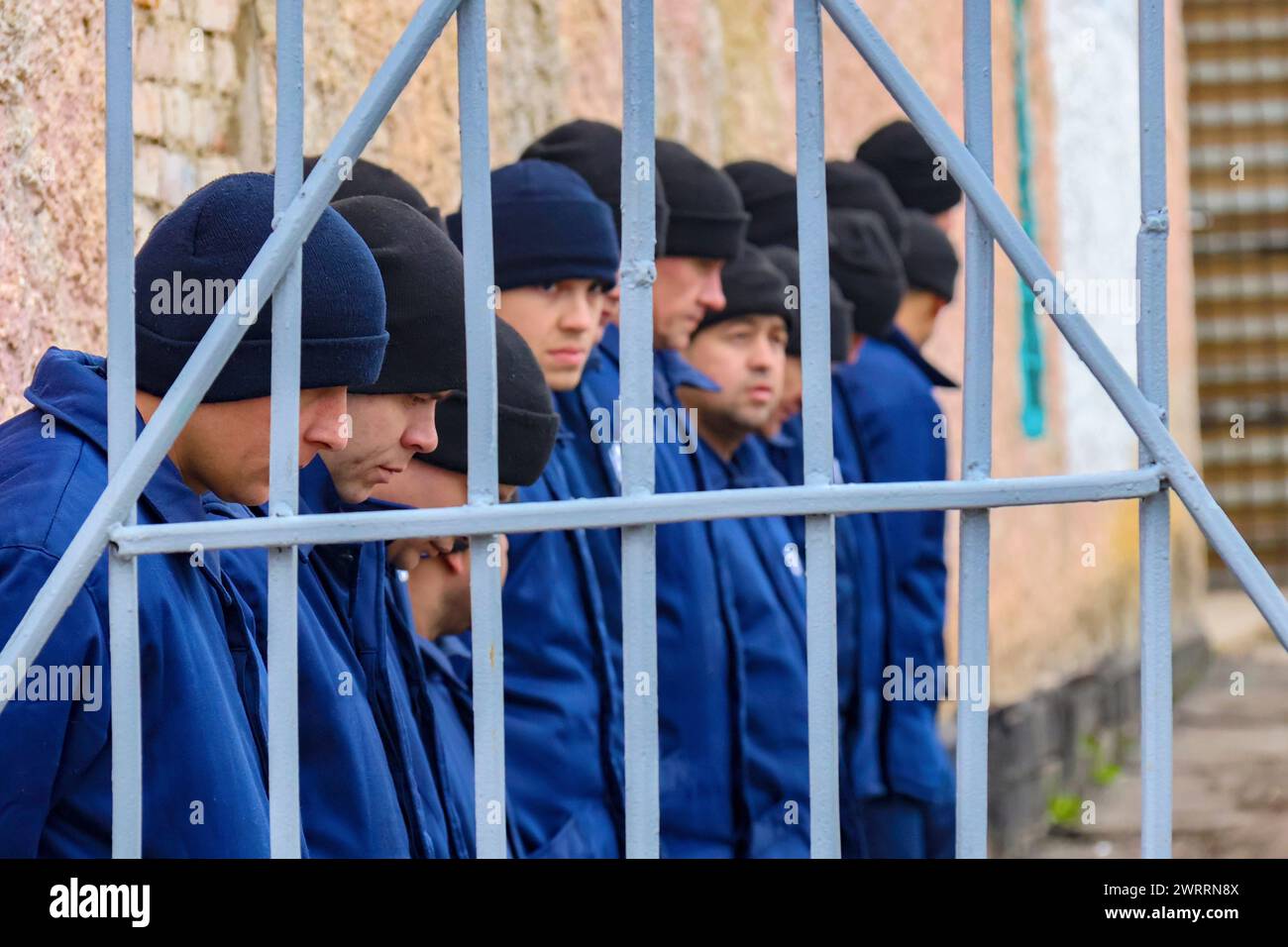 UKRAINE - MARCH 17, 2024 - Russian POWs in blue uniforms line up in ...