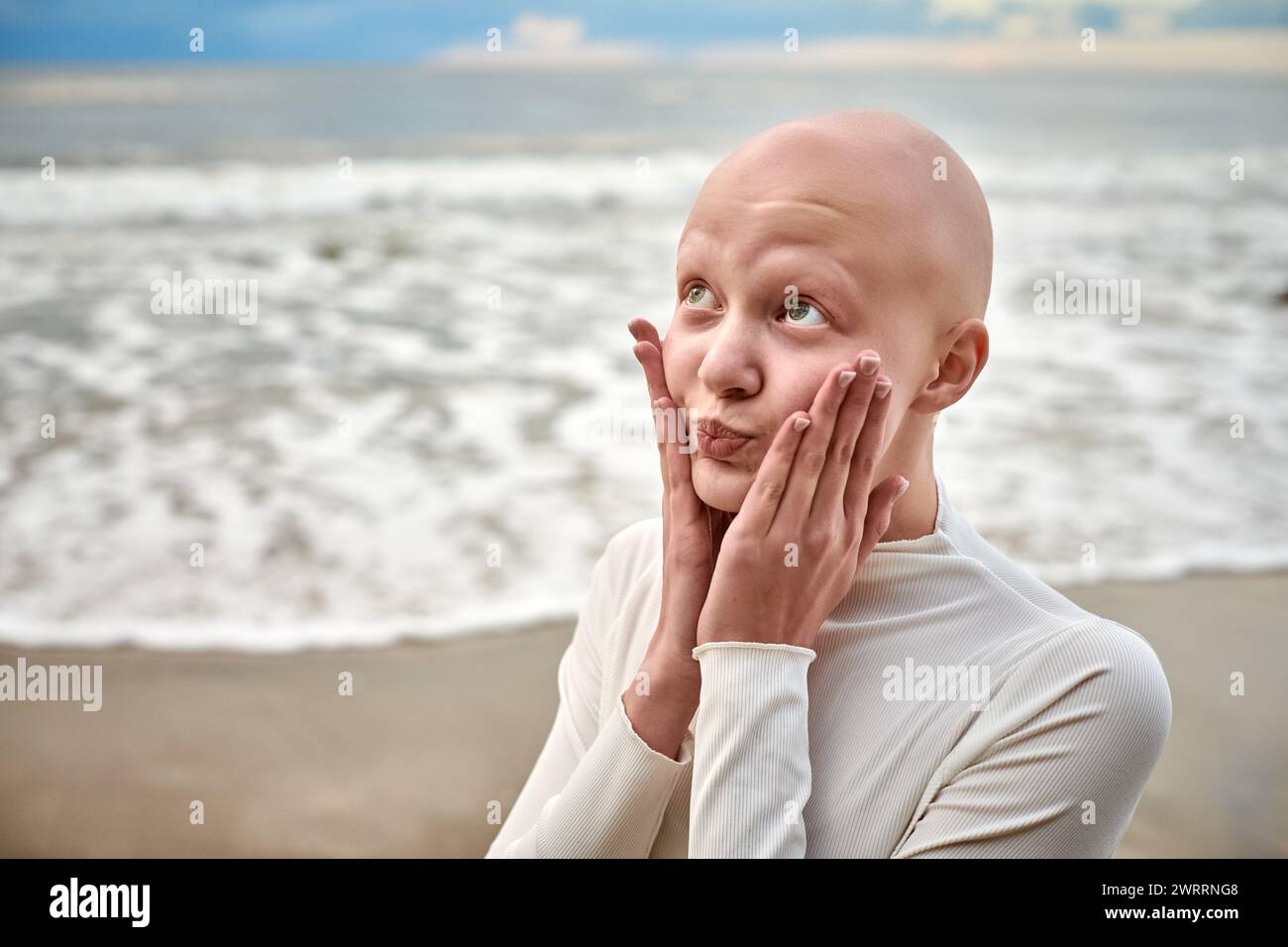 Hairless girl with alopecia make faces in white futuristic costume on ...