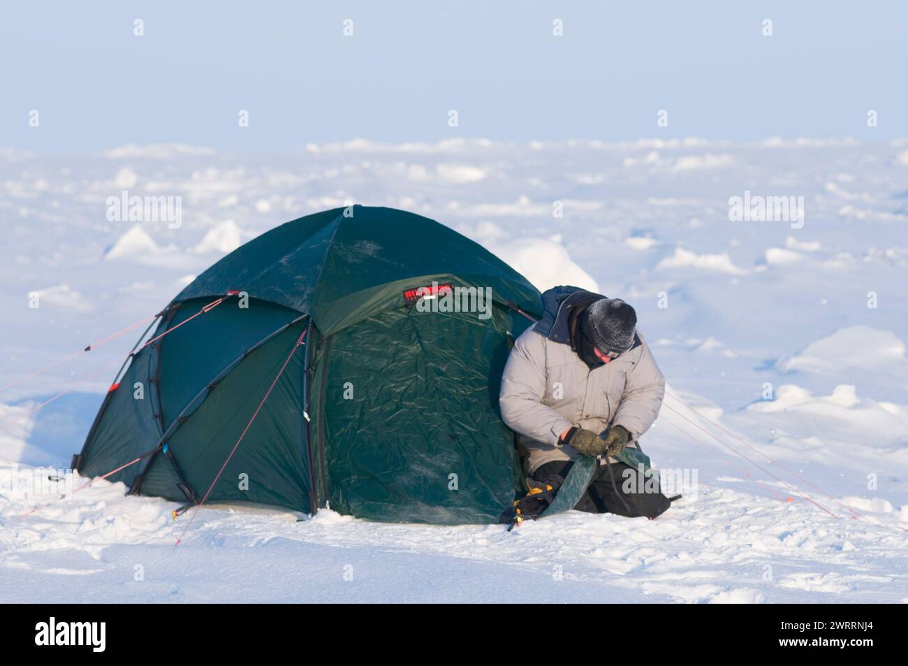 Photographer with camera and Hilleberg tent camped along the arctic ...
