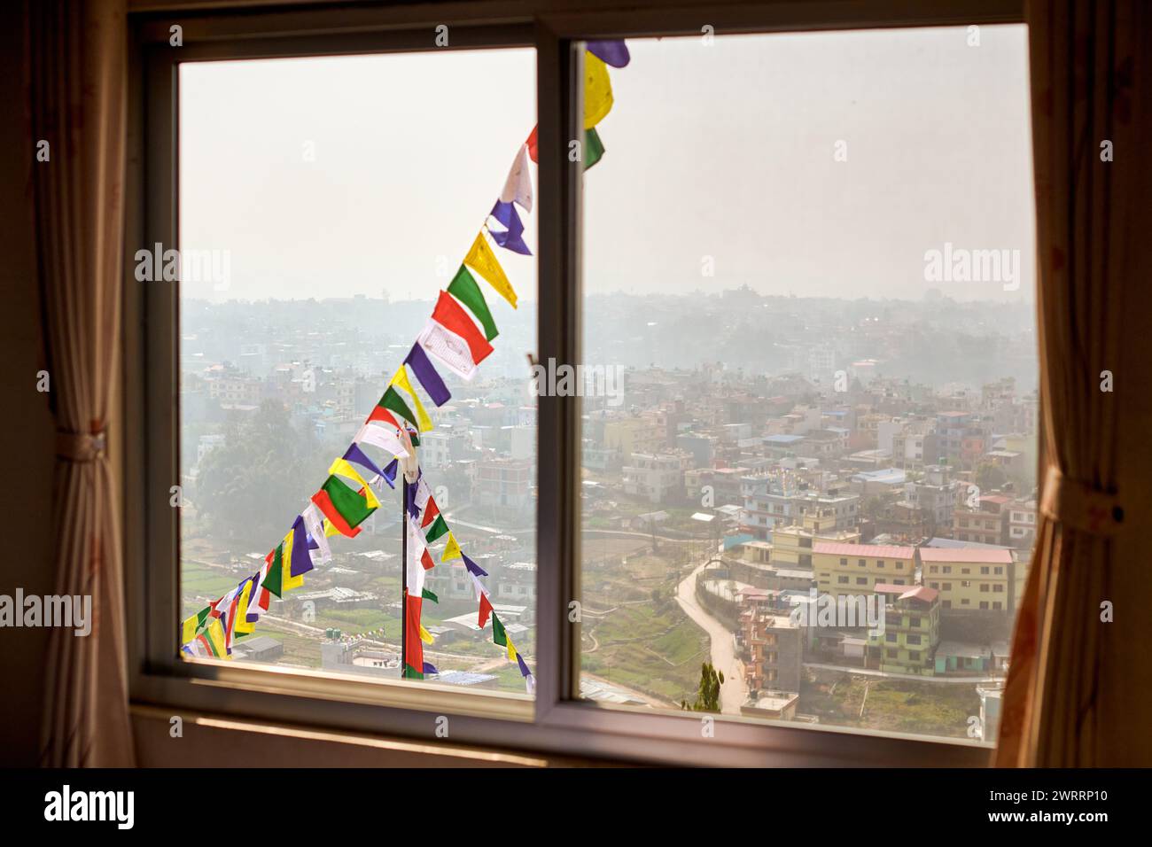 View of Kathmandu from hotel window through urban haze with lot of low ...