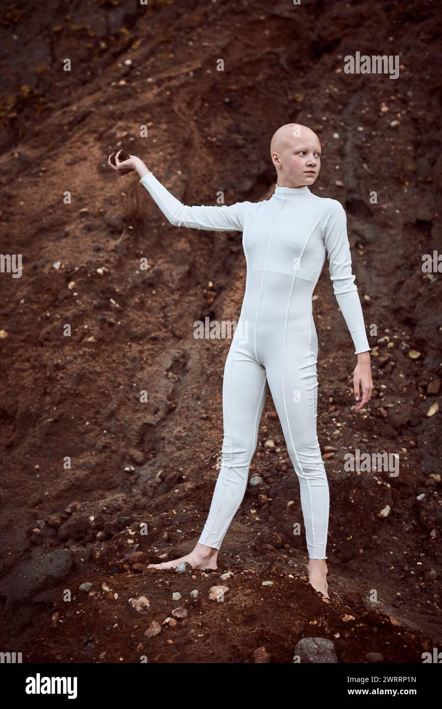 Full length portrait of young hairless girl with alopecia in white ...