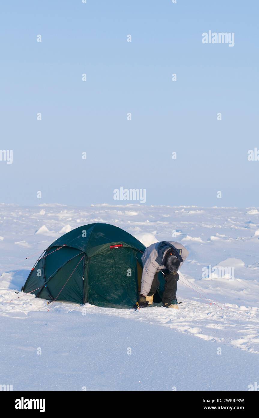 Photographer with camera and Hilleberg tent camped along the arctic ...