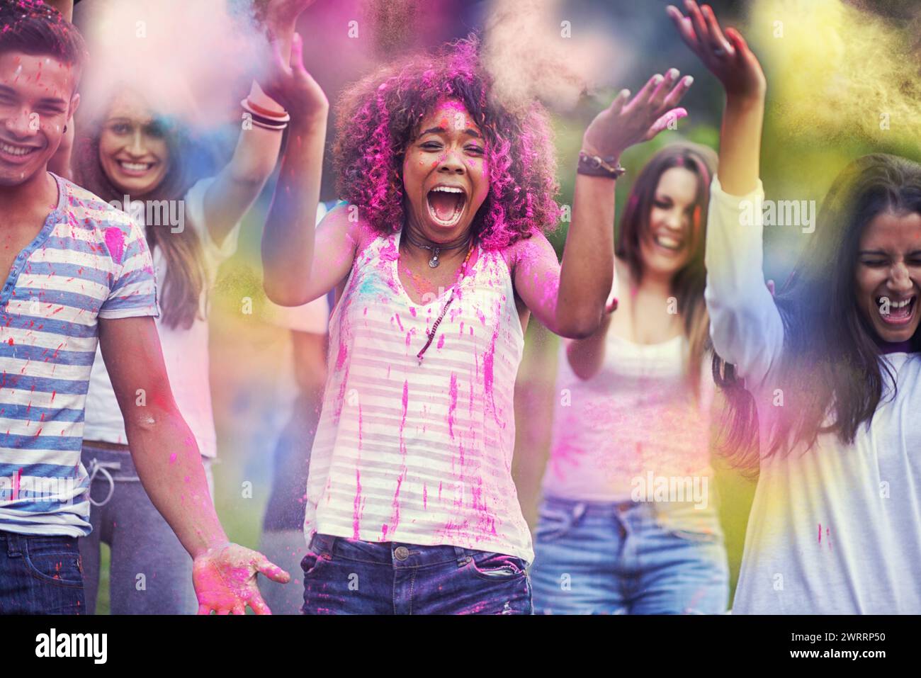 Friends, excited and powder paint at color festival in park, happiness ...