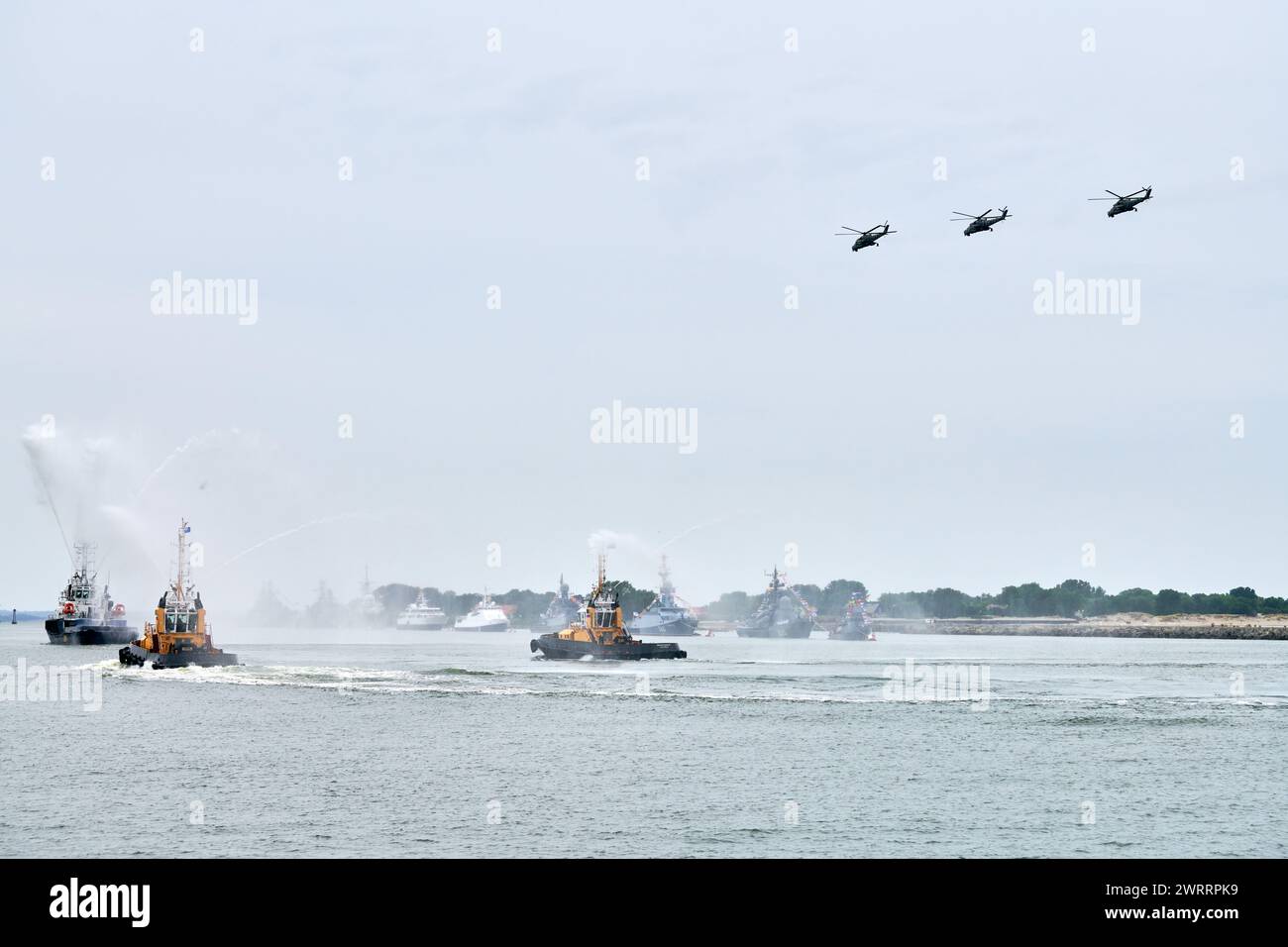 Fireboat sailing along Russian naval forces parade warships with ...