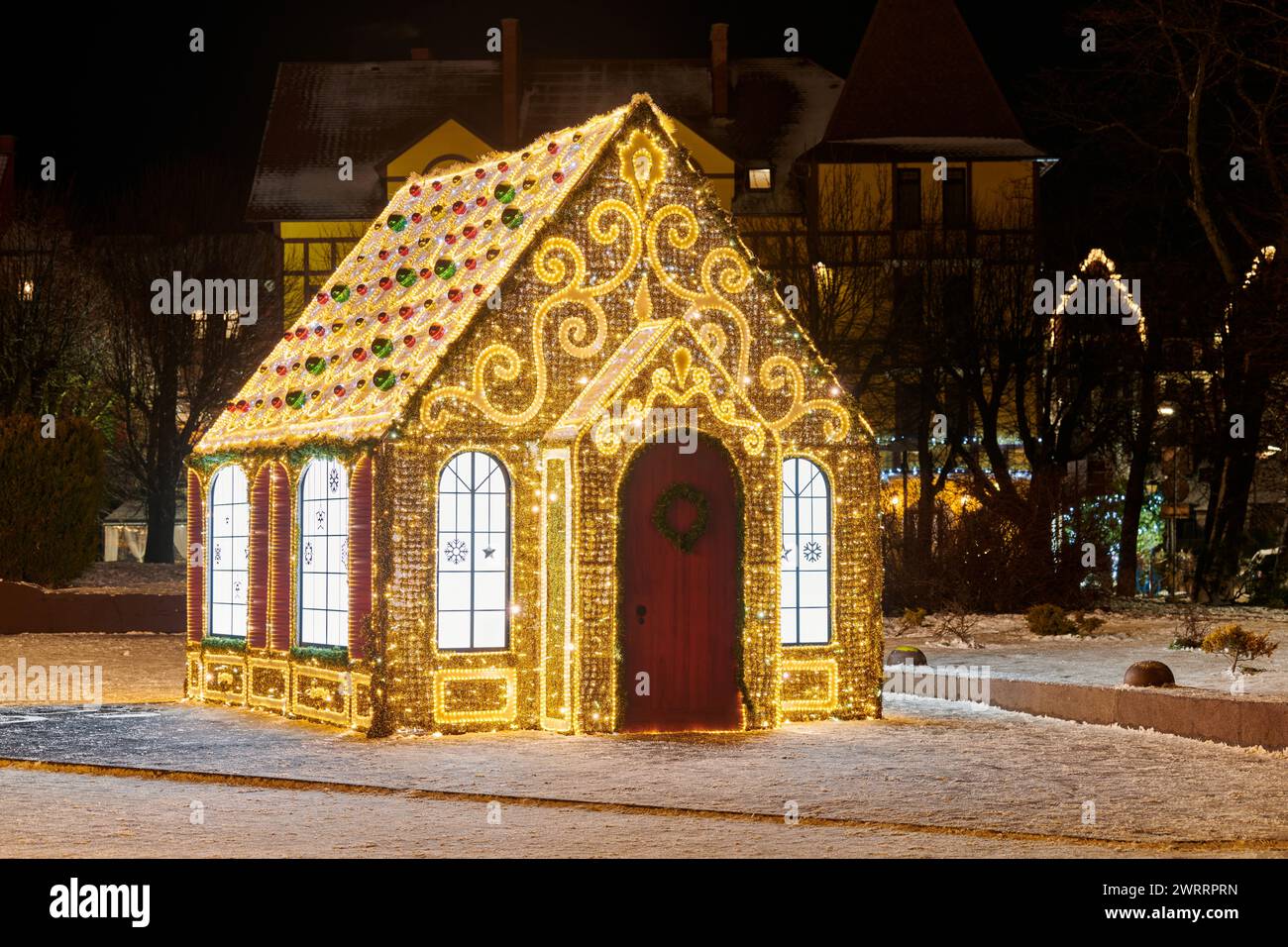 Small fairy tale house decorated with twinkling garlands lights and ...