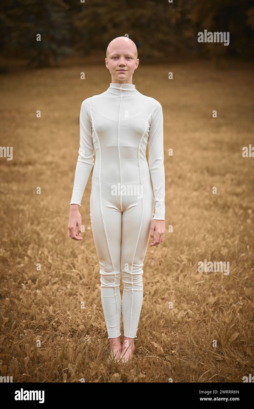Full length portrait of young hairless girl with alopecia in white ...