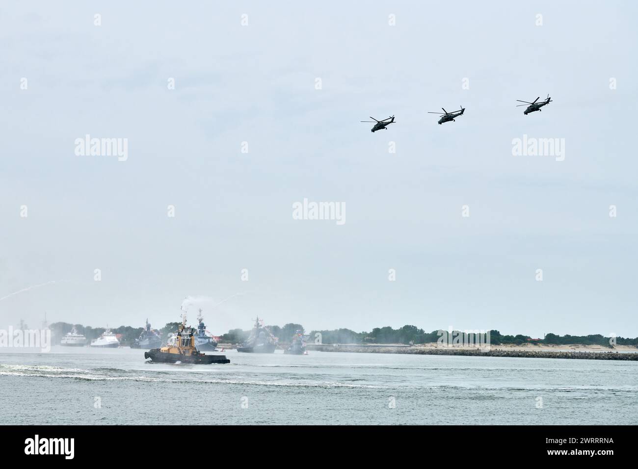 Fireboat sailing along Russian naval forces parade warships with ...