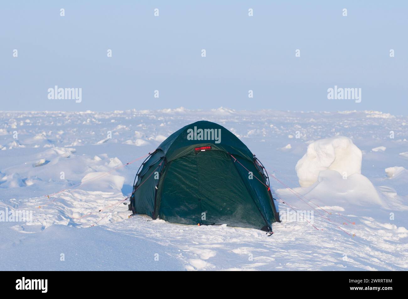 Photographer Steven Kazlowski with camera tripod and Hilleberg tent ...