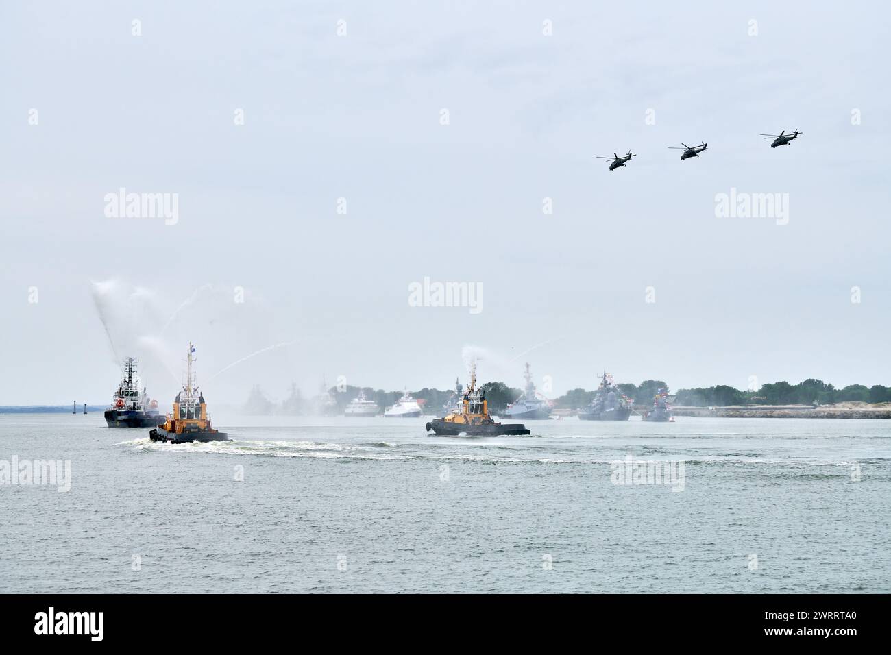 Fireboat sailing along Russian naval forces parade warships with ...