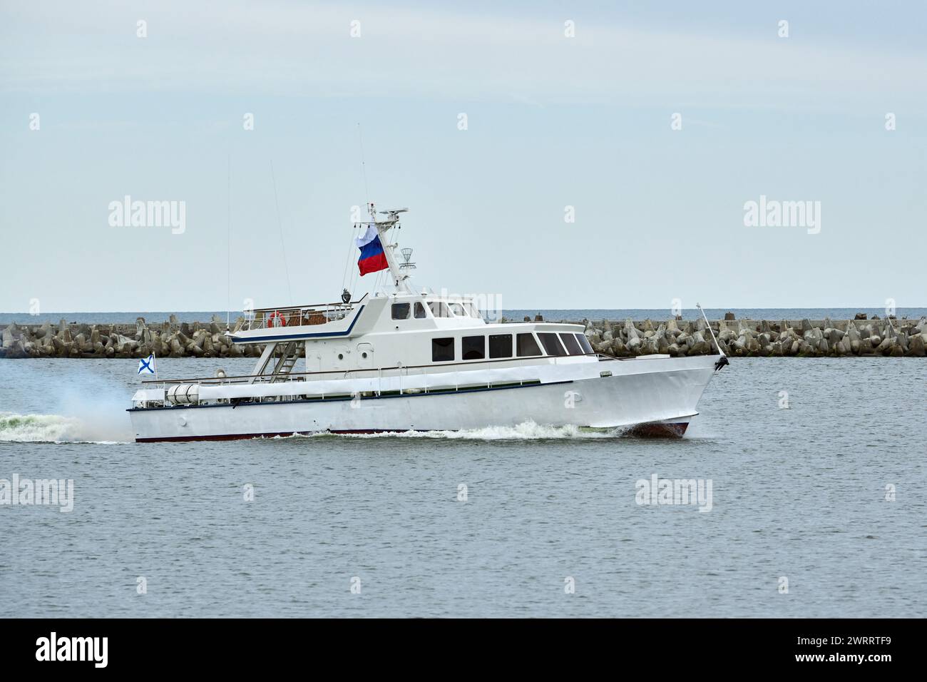 Coast guard ship sails along seaside for safeguarding coastal ...