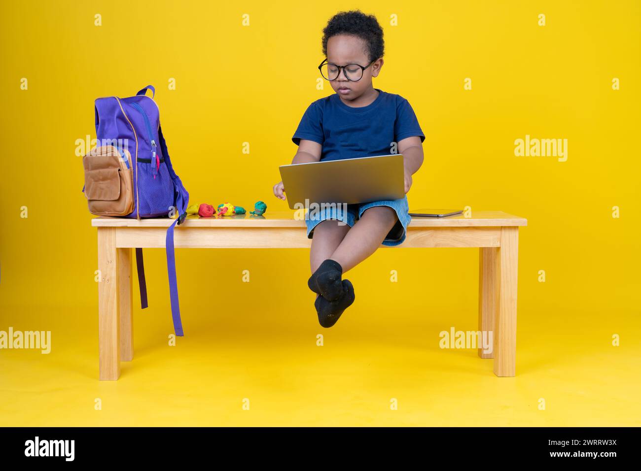 Indian school boy with laptop hi-res stock photography and images - Alamy
