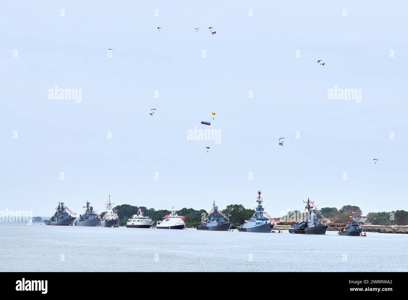 Airborne forces paratroopers flying Russian flag over naval forces ...