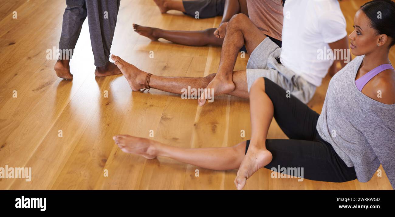 Stretching, legs and feet of people in class on floor to start dance ...