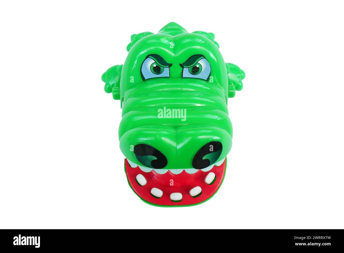 Crocodile bites plastic toy isolated Stock Photo - Alamy