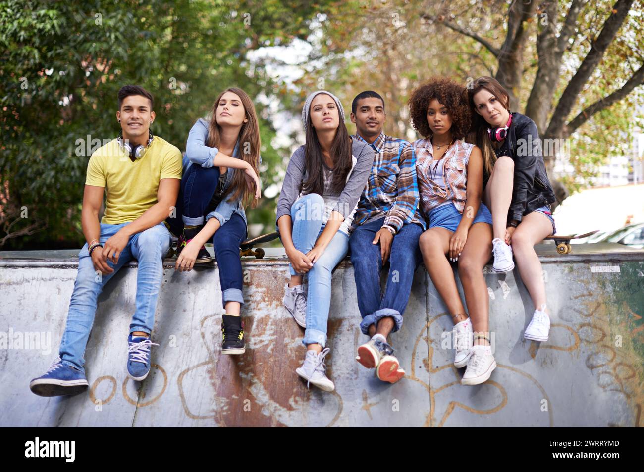 Group young gen friends sitting hi-res stock photography and images - Alamy